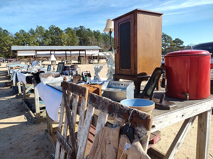 Weathered farm tools and vintage furniture sit roadside like artifacts from a simpler time waiting for new homes.