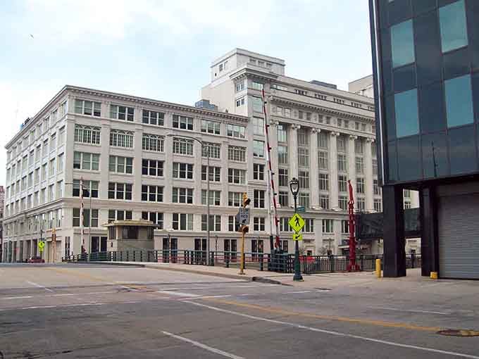 Classic Milwaukee architecture meets modern urban design, where ornate windows and clean lines share the same block harmoniously.
