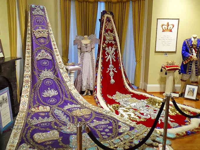 Royal robes cascade across the floor like jeweled waterfalls, each bead telling stories of carnival glory.