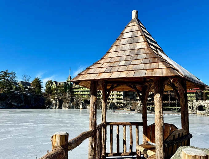 That frozen lake and rustic gazebo create a winter postcard that Currier and Ives would envy.