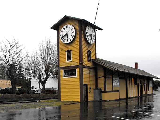 That cheerful yellow clock tower stands proud like a European village timekeeper, watching over the quiet streets below.