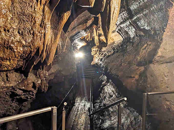 Those dramatic stone formations inside stretch toward the ceiling like nature's own cathedral built over millions of years.