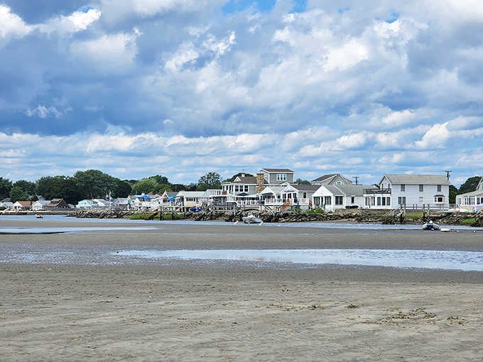 Low tide reveals the beach while waterfront architecture shows off its classic coastal Connecticut style.