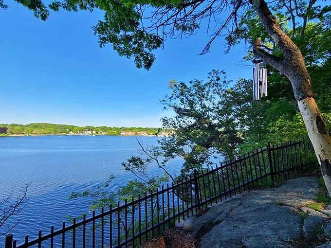 Wind chimes dance above the water while that view stretches endlessly, offering pure tranquility for weary souls.