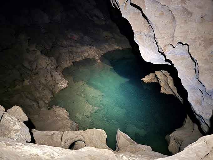 This underground pool glows turquoise in the darkness, a hidden gem that stays a cool fifty degrees year-round.