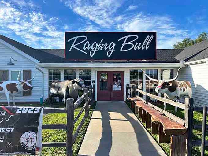 Morning light catches those longhorn sculptures perfectly, standing guard like delicious sentinels welcoming you to beef paradise ahead.