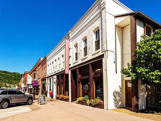 Classic storefronts line sun-drenched sidewalks, their vintage facades whispering stories of river commerce and small-town American dreams.