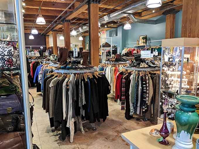 Exposed wooden beams and turquoise walls create an industrial-chic atmosphere where vintage meets contemporary style perfectly.