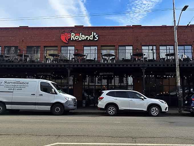 Roland's cheerful sign beckons hungry diners to discover why locals consider this their go-to spot for ocean-fresh flavors.
