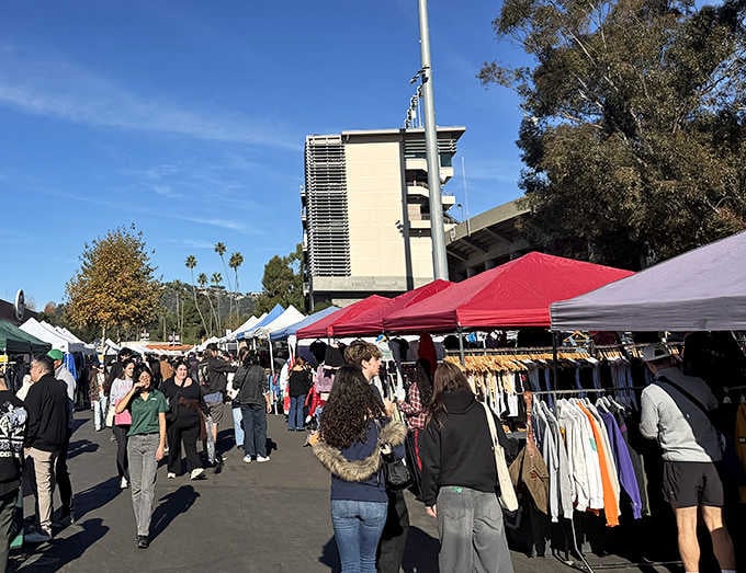 The iconic Rose Bowl stadium looms in the background, watching over shoppers hunting for vintage gold.