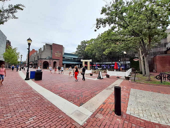 Brick pathways lead visitors through this bustling plaza where modern life swirls around historic market buildings every single day.