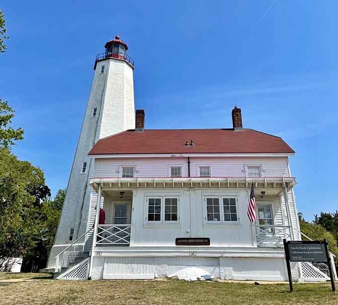 That bright American flag and pristine white keeper's quarters create a scene worthy of a Norman Rockwell painting.