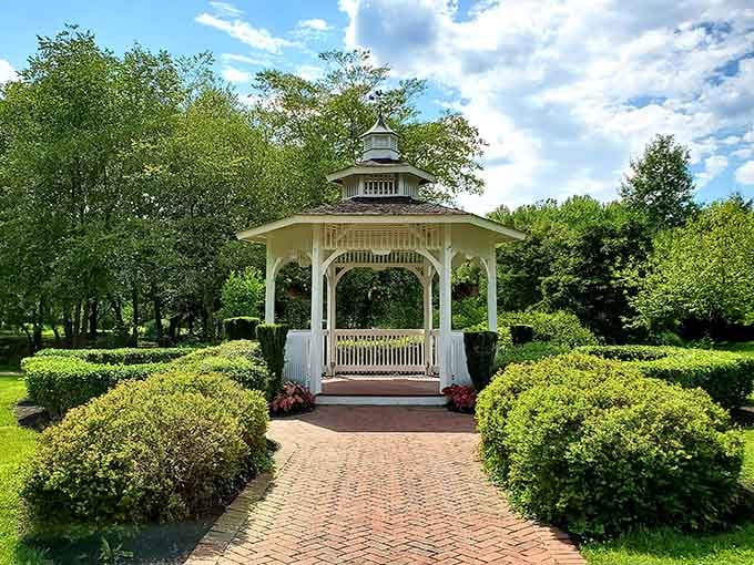 The brick pathway leading to this classic white gazebo feels like walking straight into a Thomas Kinkade painting.