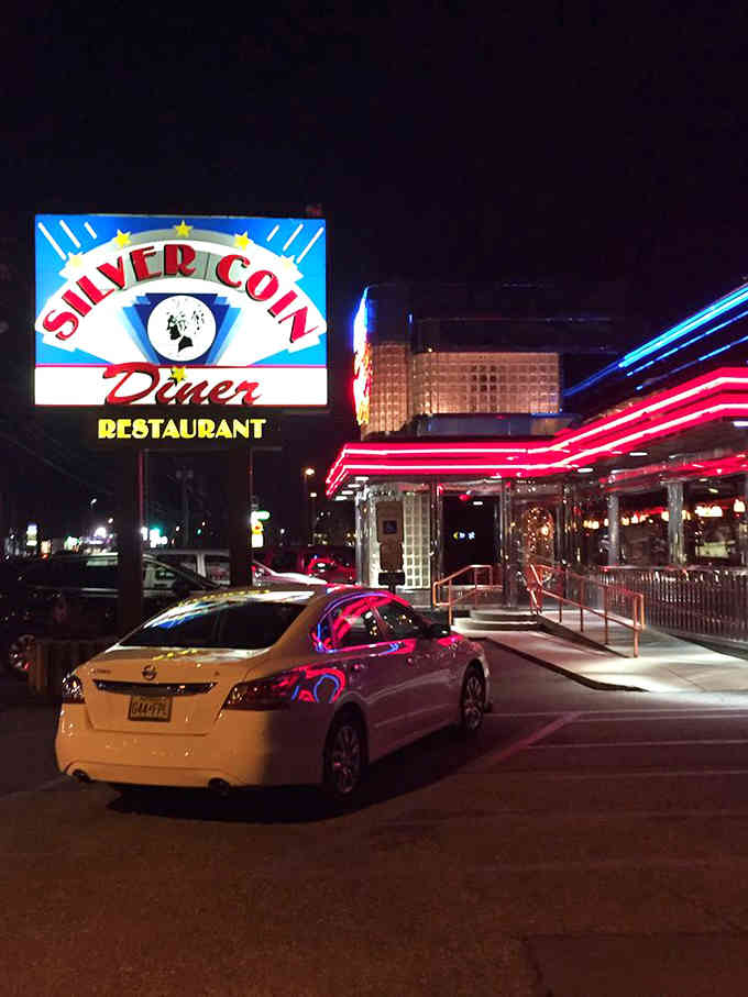 That vintage sign glows like a time machine beacon, promising burgers and nostalgia under classic diner lights.