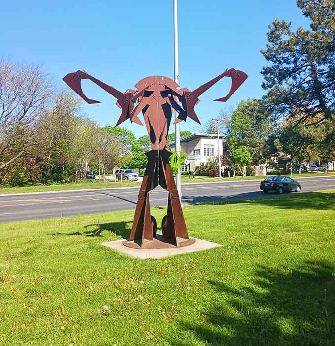 This abstract steel creature stands proud on its corner like a neighborhood mascot welcoming everyone who passes.