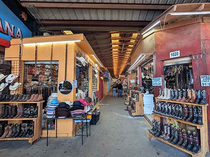 Cowboy boots march in formation along these walls while hats stack high enough to outfit every extra in a Western movie.