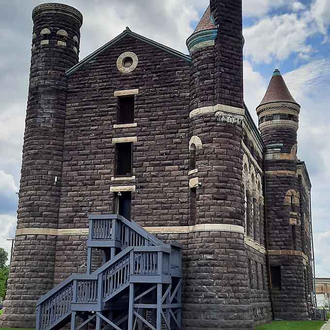 Those fortress-like walls and narrow windows remind us that justice once came with very thick stone barriers attached.