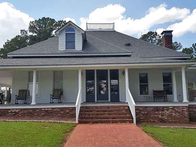 Brick steps lead to rocking chairs and home cooking, where Southern charm meets serious steak expertise perfectly.