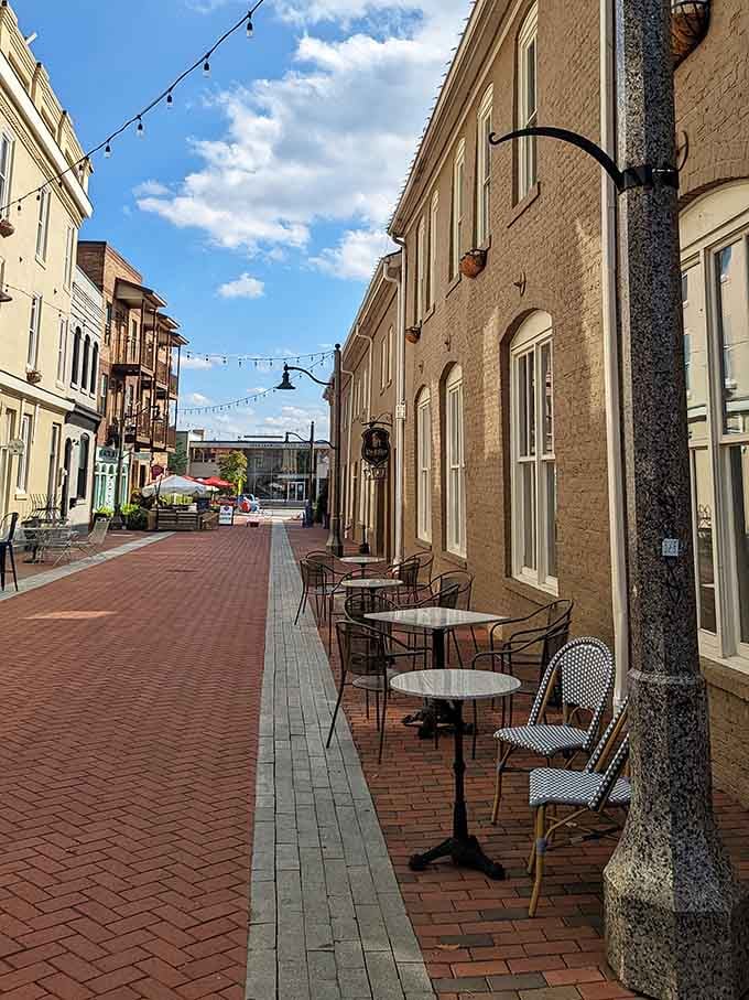 Sidewalk tables under string lights transform dinner into a European-style evening without the passport or jet lag.