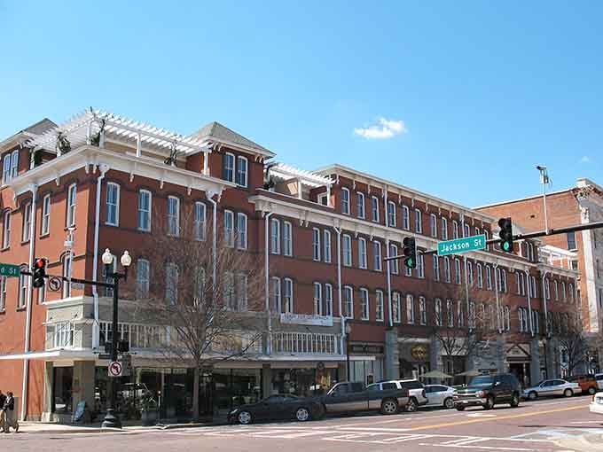 Red brick buildings stand proud against blue skies, their historic facades holding stories worth more than any museum ticket.