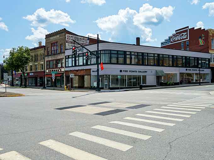 The historic storefronts here blend old advertising with modern businesses, proving the past and present can share the same address.