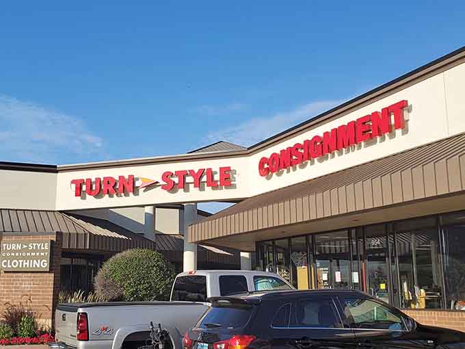 Lush landscaping frames this upscale consignment shop where quality meets affordability under sunny skies.