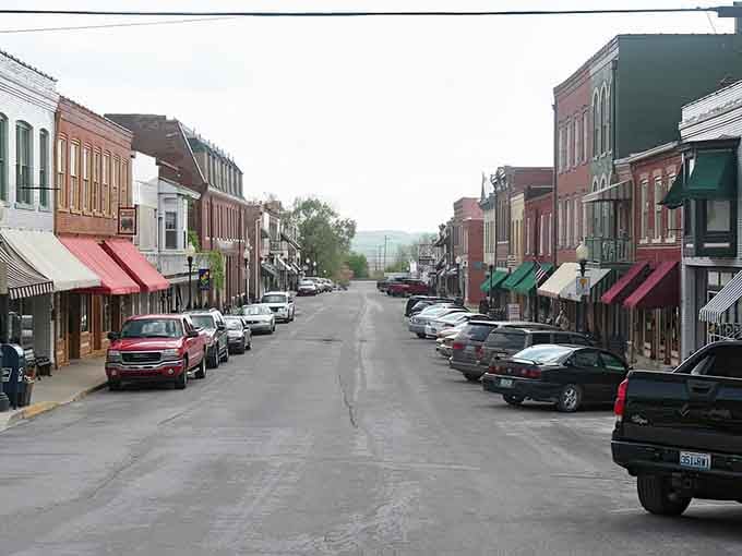 Those colorful awnings pop against weathered brick like a Wes Anderson film set in the heartland's embrace.