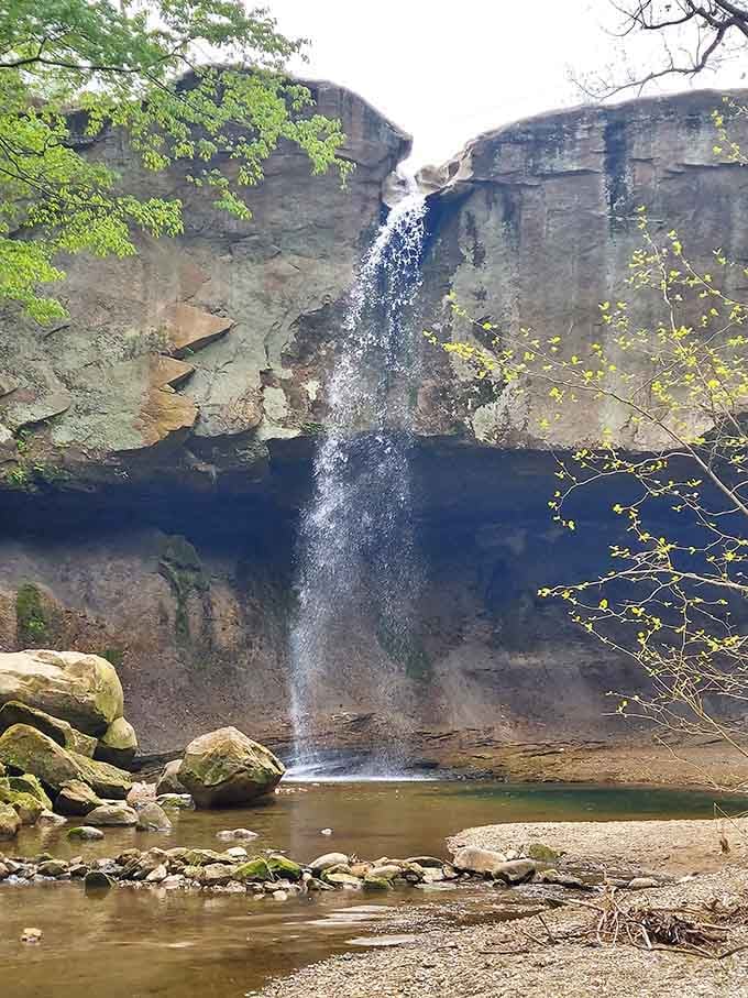 Limestone cliffs frame a 90-foot waterfall that's been the town's stunning centerpiece since long before Instagram existed.