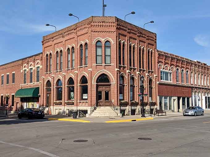 Magnificent Romanesque brickwork transforms a corner building into an architectural treasure that commands attention and respect.