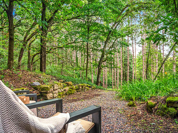 Cozy outdoor seating surrounded by lush forest invites you to relax like a proper hobbit enjoying second breakfast.