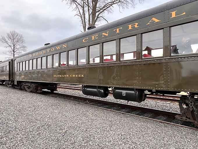 The Woodstown Central passenger car gleams with vintage elegance, promising comfortable journeys through the countryside ahead.