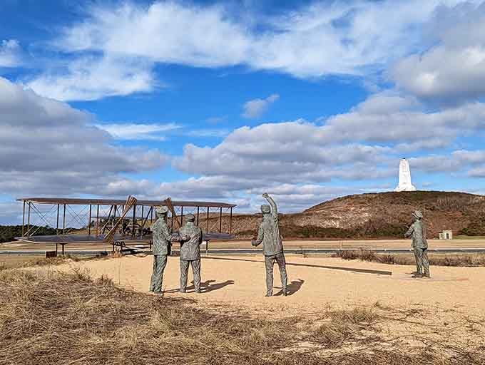 Bronze figures frozen in time celebrate the moment when two bicycle mechanics changed human history forever on this windswept coast.