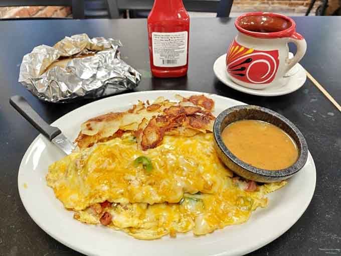 The Denver omelet arrives loaded with all the fixings, proving breakfast doesn't need to be complicated.