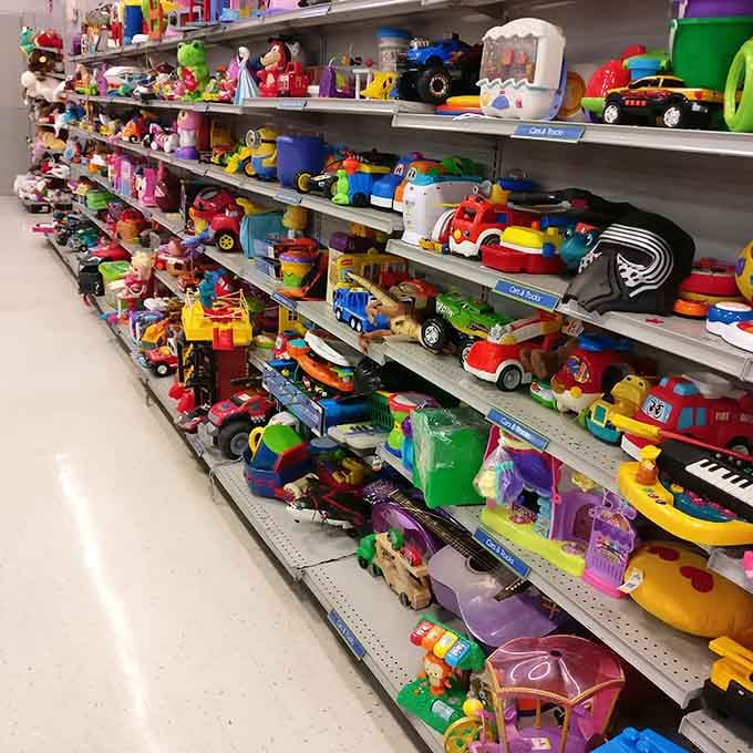 Kids' toys lined up like a rainbow of plastic possibilities, minus the new-in-box price tags.