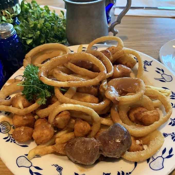 Onion rings and Swedish meatballs sharing a plate is the kind of cultural fusion that makes perfect, delicious sense.