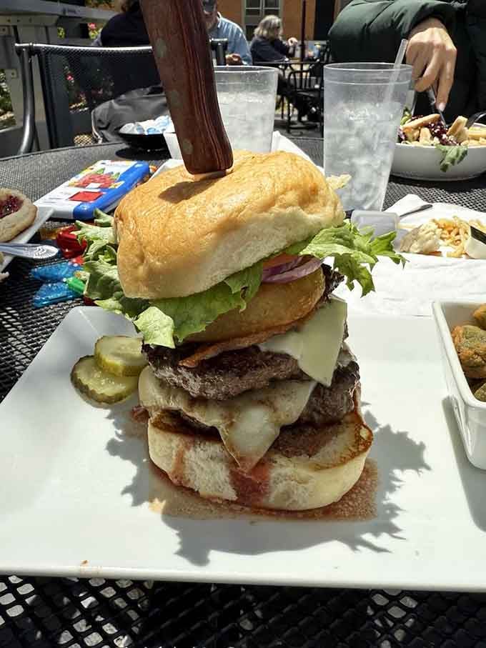 This burger tower defies gravity and possibly several laws of physics, but who's complaining when it tastes this good?