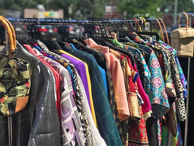 Outdoor racks showcase a rainbow of clothing options, because even the parking lot gets in on the action.