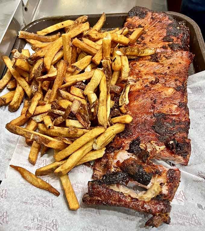 A full rack with a mountain of fries: this is what portion control looks like when nobody's counting calories.