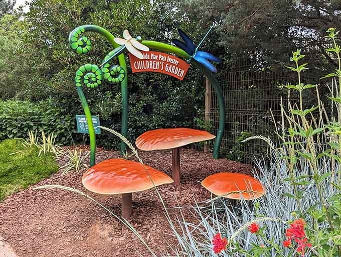 The children's garden entrance promises adventures where imagination grows as abundantly as the flowers surrounding it.