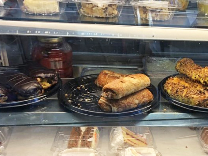 Golden blintzes waiting patiently in the case, ready to make your breakfast dreams come absolutely true.