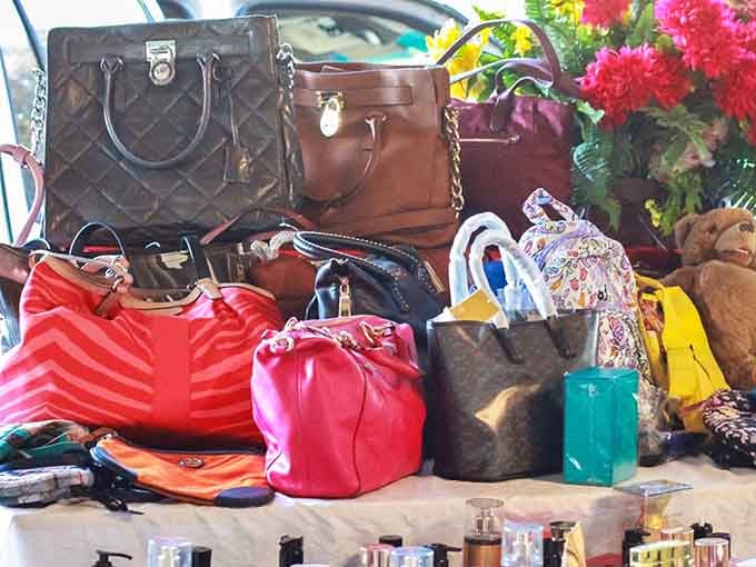 Designer bags at flea market prices prove that luxury doesn't always require a second mortgage or trust fund.