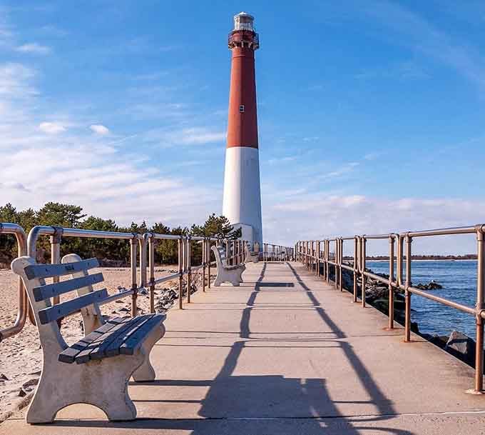 The walkway to the lighthouse feels like a red carpet, except the paparazzi are just seagulls.