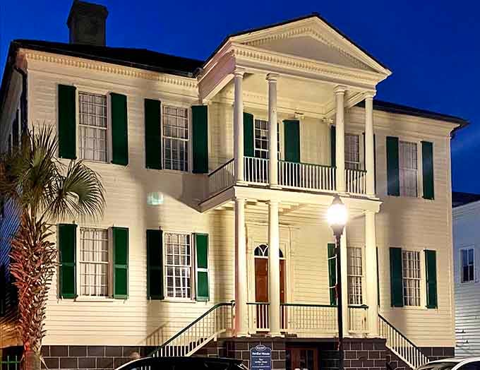 Those columns glow against the evening sky like something from a Tennessee Williams play, all drama and Southern elegance.