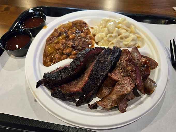 When your plate arrives looking like a barbecue fever dream, complete with beans and mac that deserve their own spotlight.