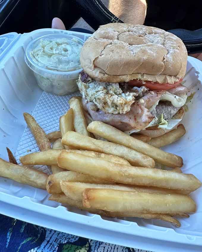 The Cape Maye towers like a delicious skyscraper, loaded with bacon, egg, and enough toppings to require architectural planning.