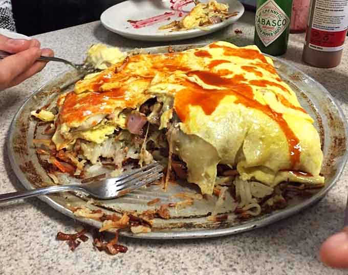 This omelet cut reveals layers of fillings that would make a geologist weep with professional envy.