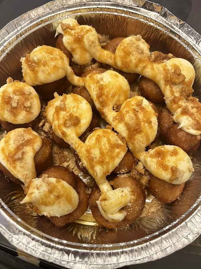 Golden pumpkin pie donuts topped with whipped cream taste like autumn decided to become portable.