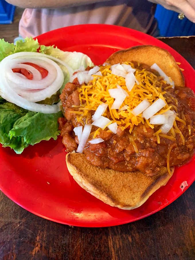 Open-faced chili perfection that requires both utensils and courage, served with enough cheese to make Wisconsin jealous.