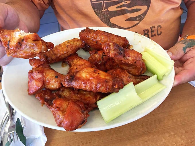 Golden, saucy, and served with celery because someone remembered vegetables exist, these wings mean business.