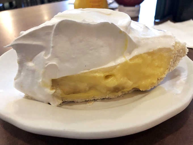 Banana cream pie topped with billowing meringue proves that some classics never need improvement, just proper execution and respect.